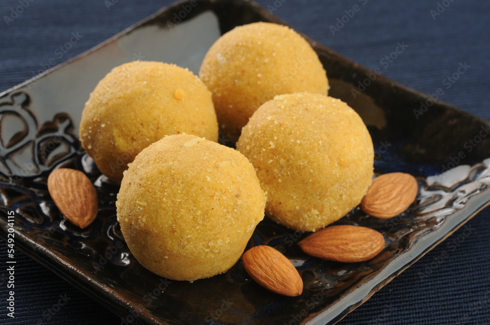 Besan ladoo, an Indian sweet dish made during festivals or celebrations ...