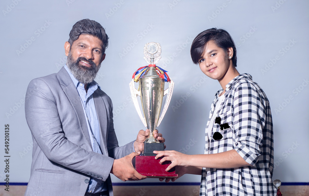 Indian man school teacher give victory golden trophy cup to girl ...