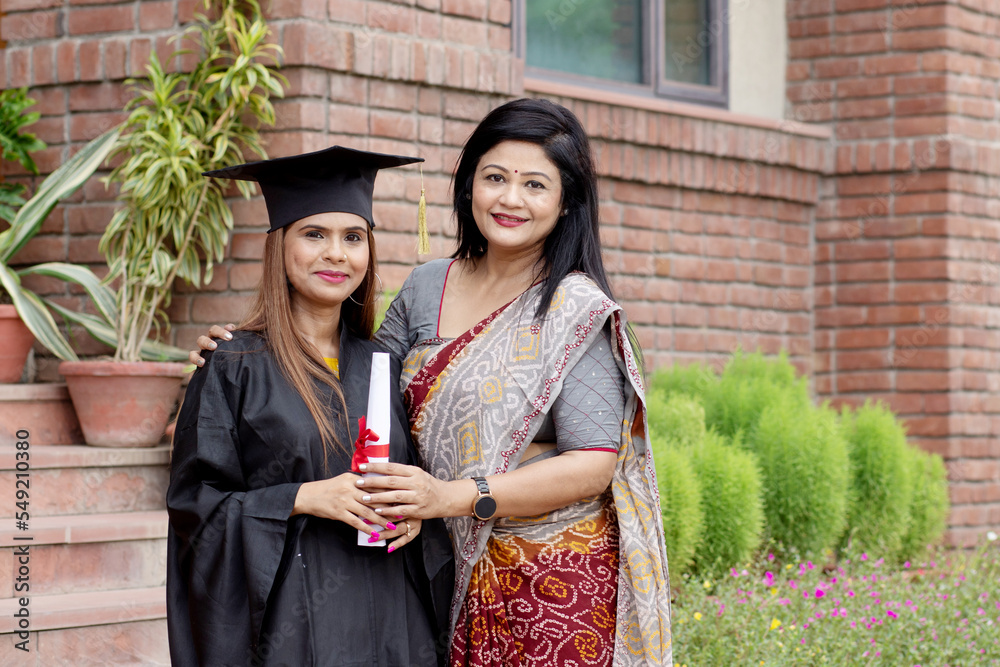 Indian university female student and her mother celebrating graduation ...