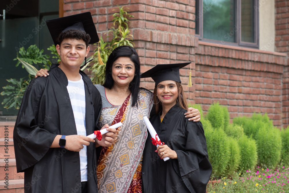 Happy Indian university student and proud mother celebrating graduation ...