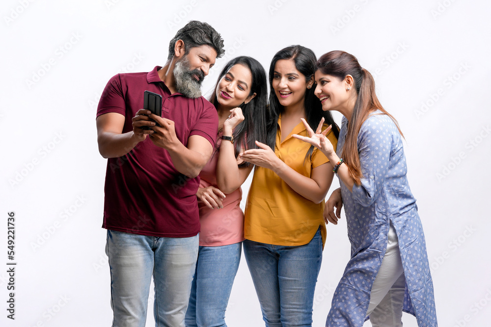 Indian friend group taking selfie on white background. Stock Photo ...