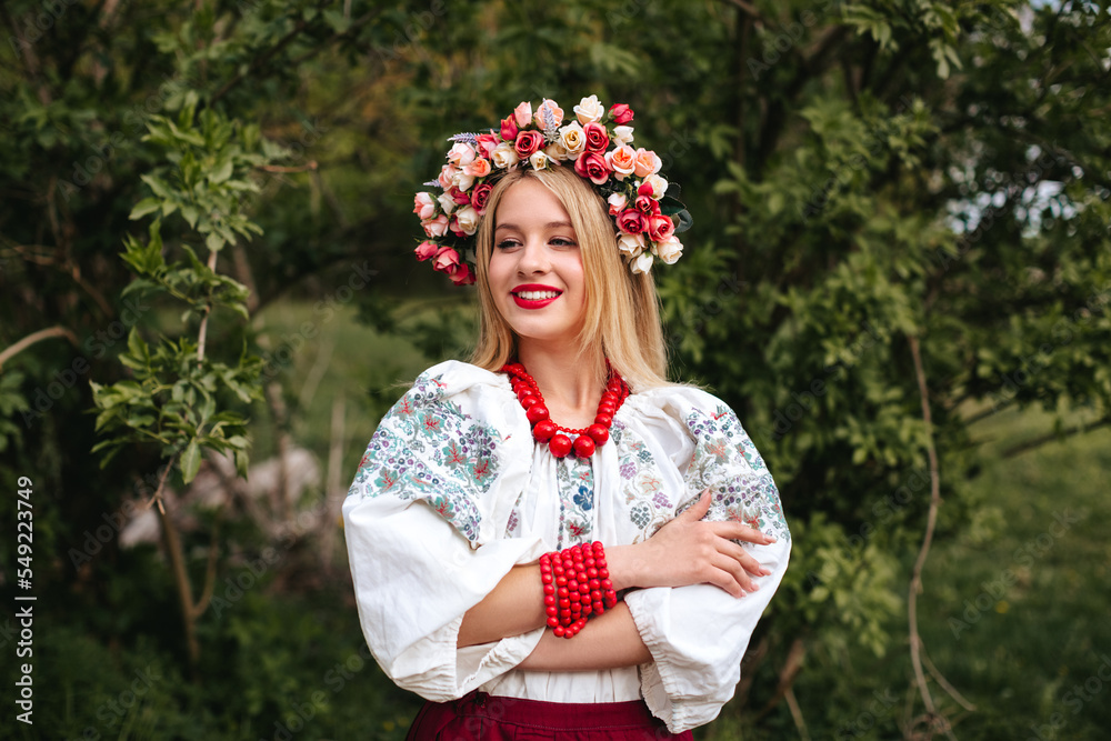 Ukrainian woman in a national Ukrainian costume and with a wreath of ...