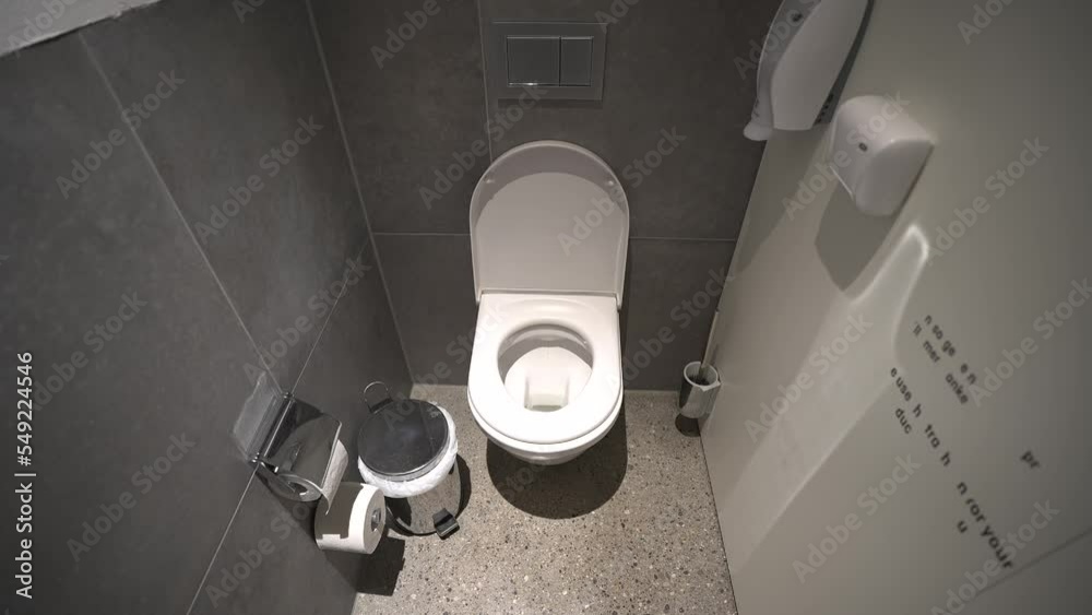 Interior modern public toilet inside the cabin with a clean WC, wall ...