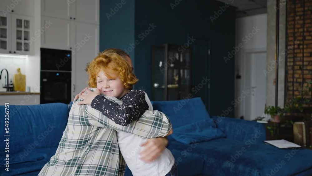 Man and preschooler boy give high five friendly and hug Stock ビデオ ...