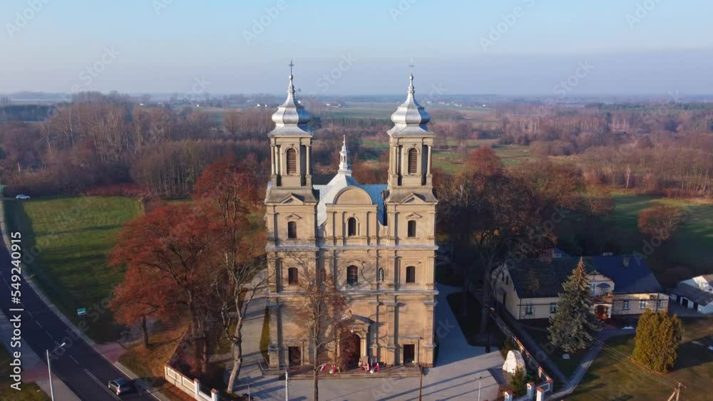 Sunset and historic church in the village of Restarzew, Poland. Stock ...