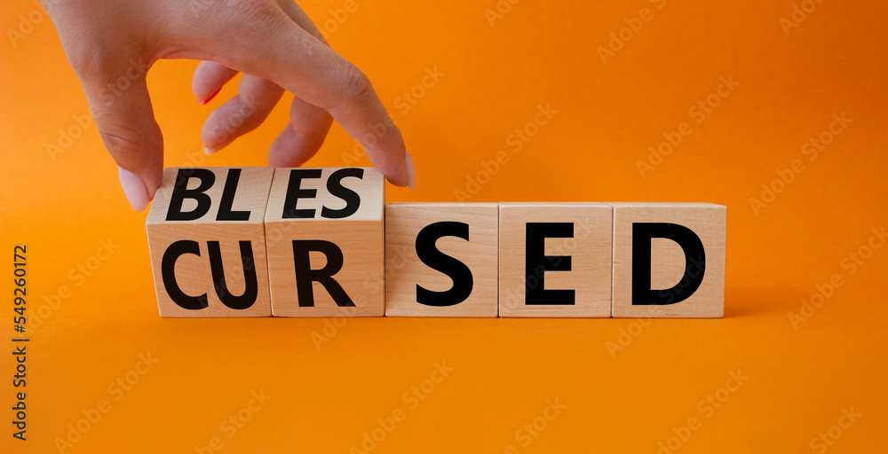 Blessed vs Cursed word symbol. Businessman Hand turns cubes with word ...