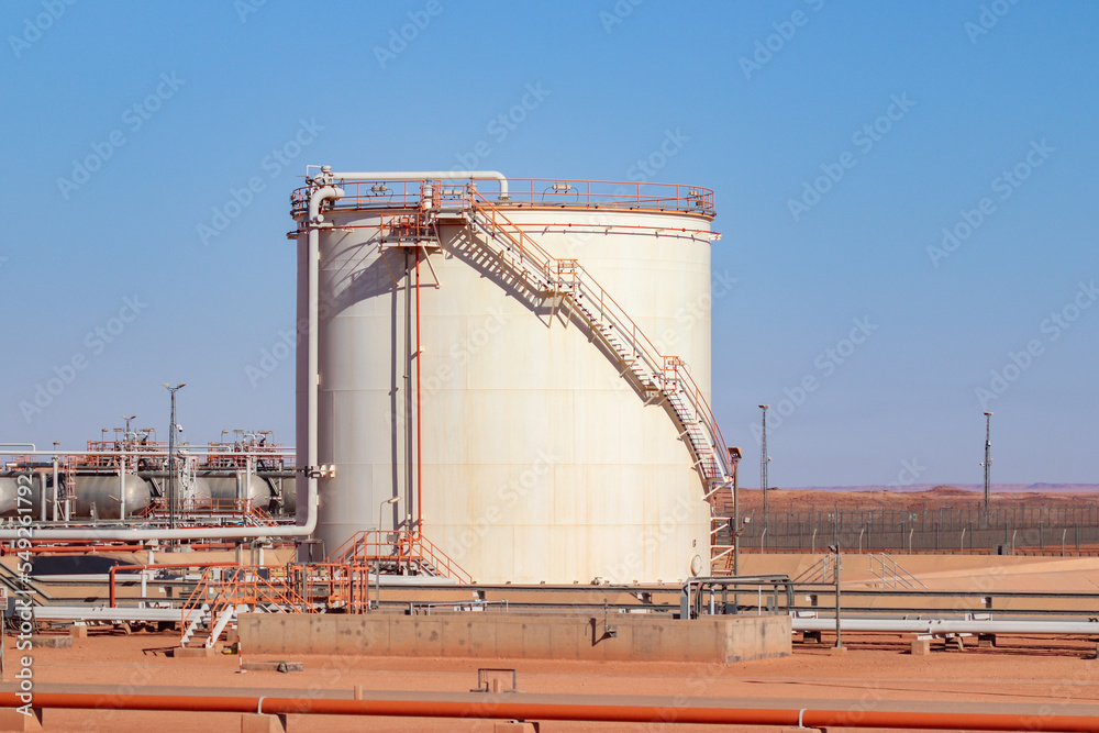 Oil storage tank, in Algerian desert oil & gas factory Stock Photo ...