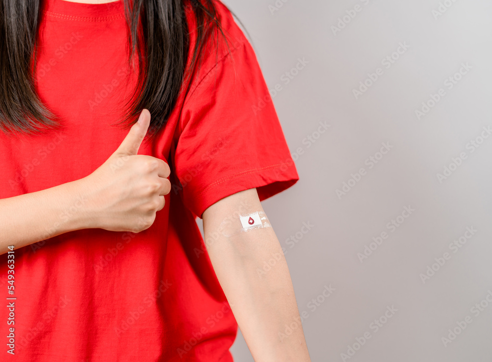 Poster woman showing plaster after donation blood, blood transfusion ...