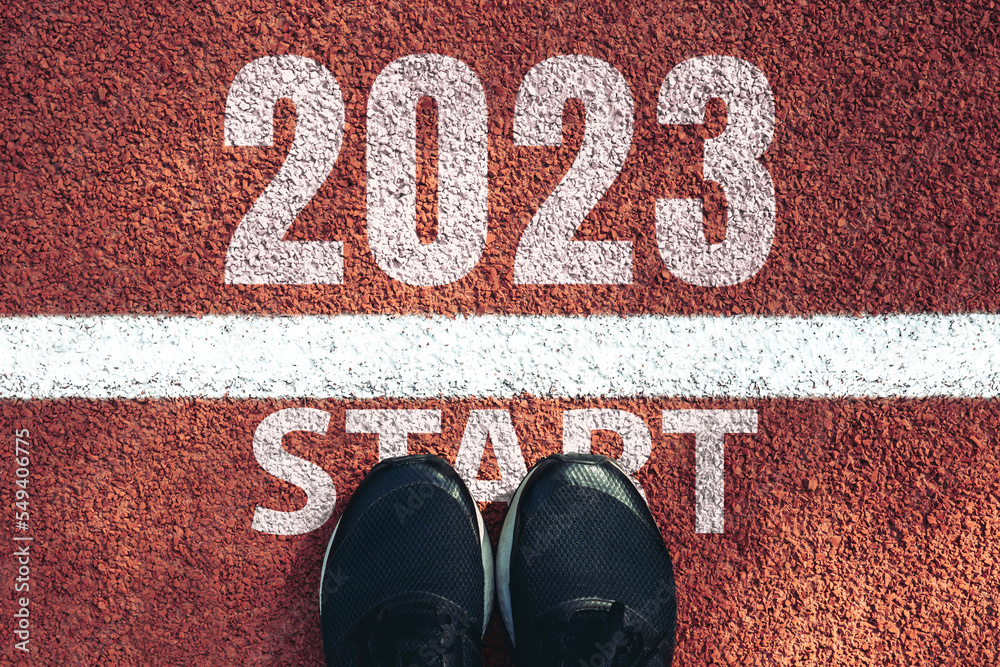 Start 2023 year concept, top view of man shoe on an athletics track ...