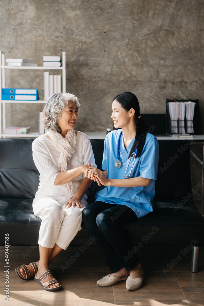 medical doctor holing patient's hands and comforting her.Kind doctor ...