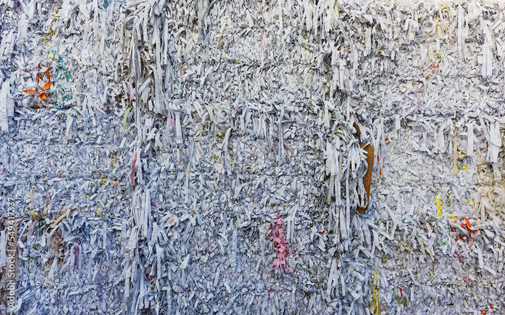stack of shredded old waste paper in front of recycling facility Stock ...