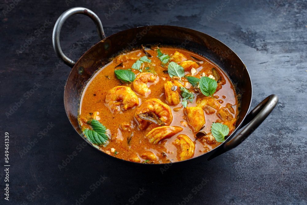 Traditional spicy Indian prawn Madras curry Rogan Josh with king prawns ...
