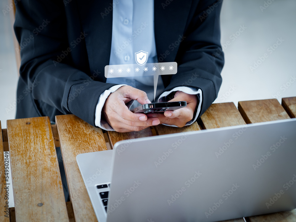 Multi factor authentication concept. Virtual safety shield icon while access on phone with ...