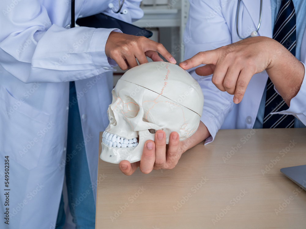 Foto de Two doctors in white uniforms talking, working together in ...