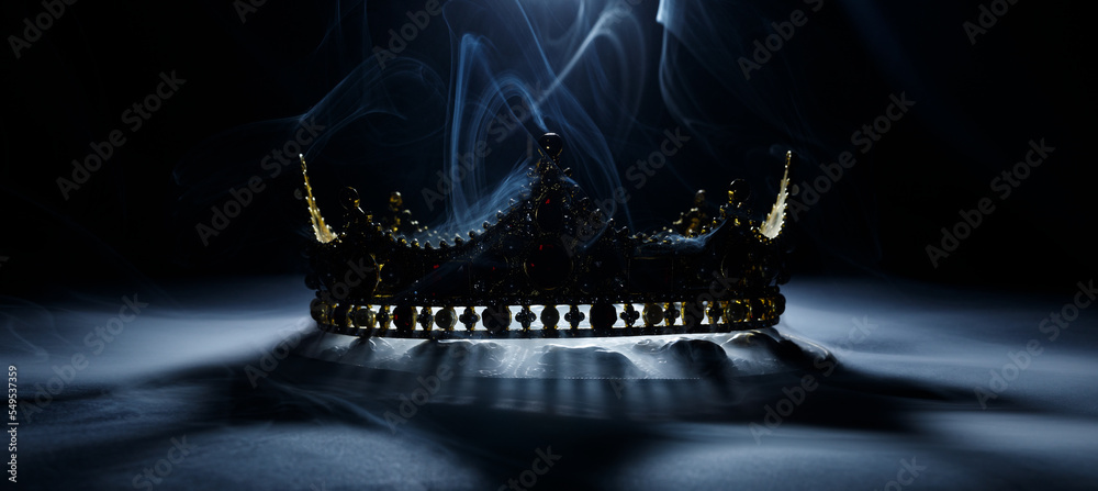 Golden crown of the king a dark background. Panoramic view of the ...