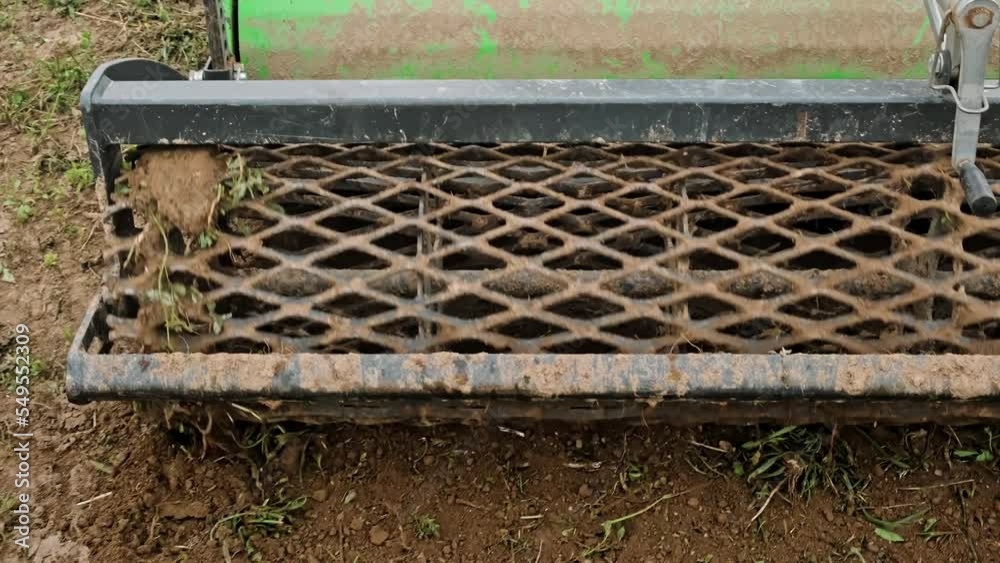 Close-up rotary cultivator attachment of small tractor. Ground leveler ...