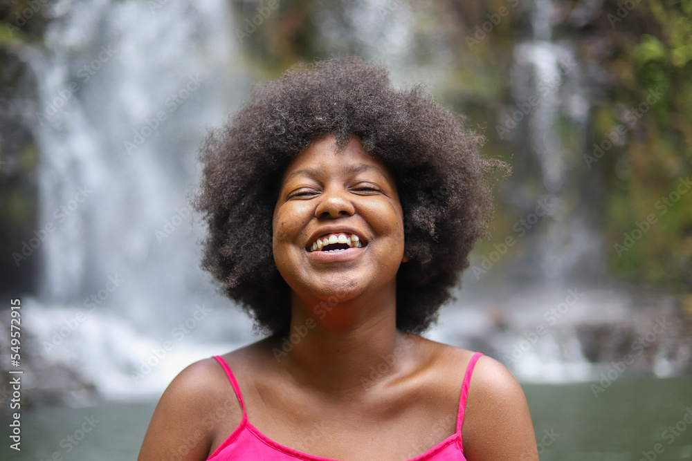 Happy Black woman with afro Stock Photo | Adobe Stock