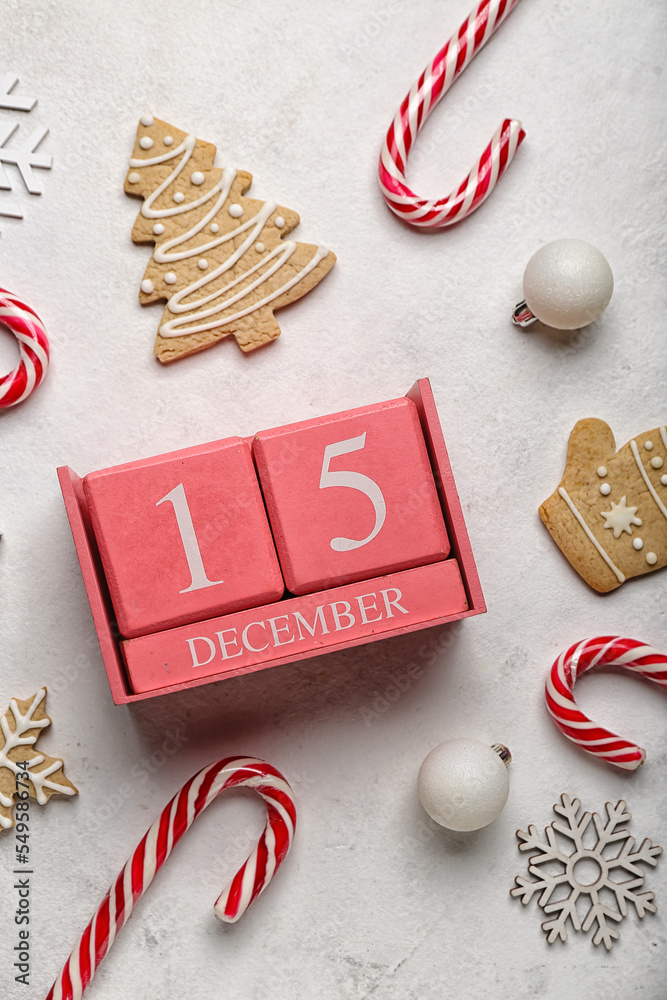 Cube calendar with date 15 DECEMBER, Christmas decor and cookies on ...