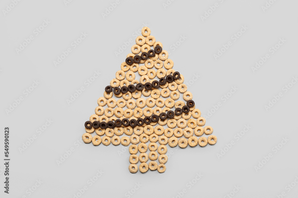 Christmas tree made of cereal rings on grey background Stock Photo ...