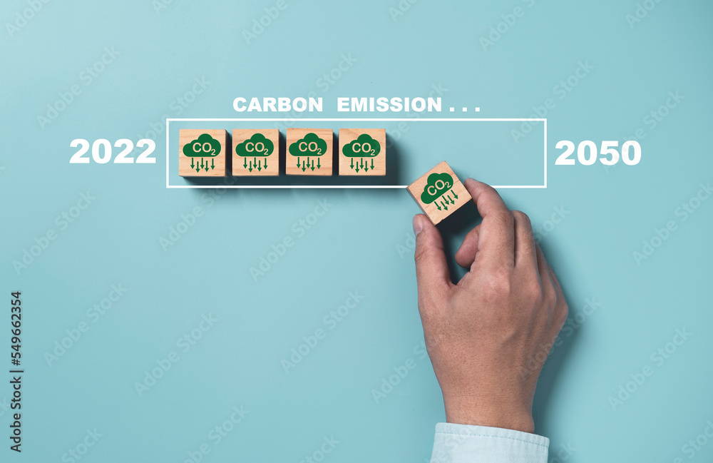 Man holding CO2 reducing icon with virtual loading for decrease CO2 ...