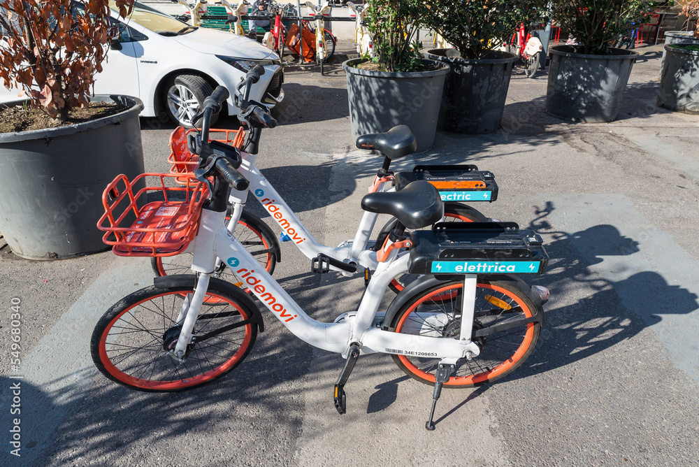 Bike sharing in a big city. Milan, Italy. Ridemovi, as written on the ...