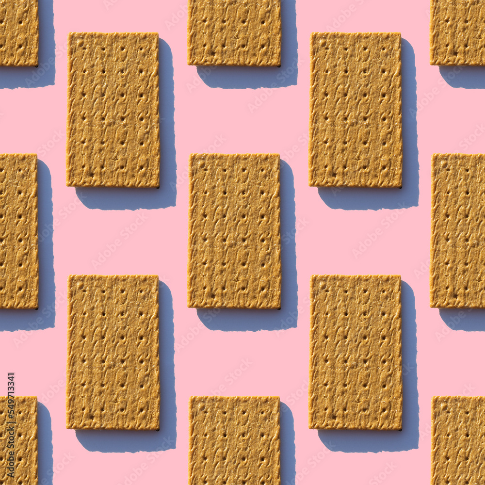 Pattern of sugar rectangular cookies with a shadow on a pink background ...