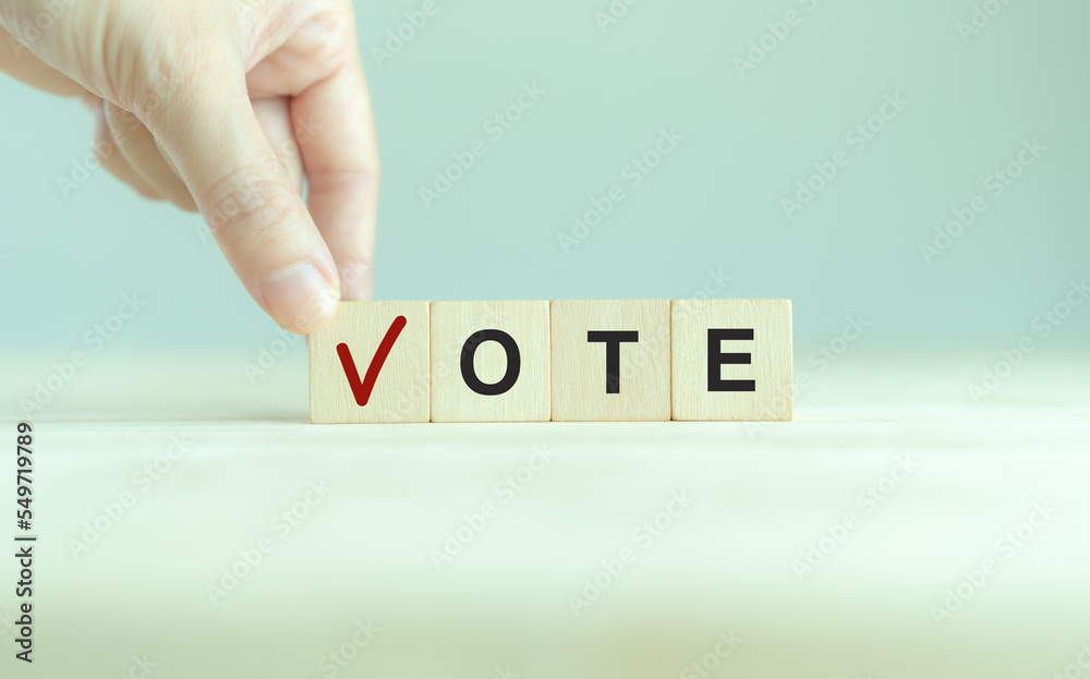Election vote concept. Vote word with checkmark symbol on wooden cube ...