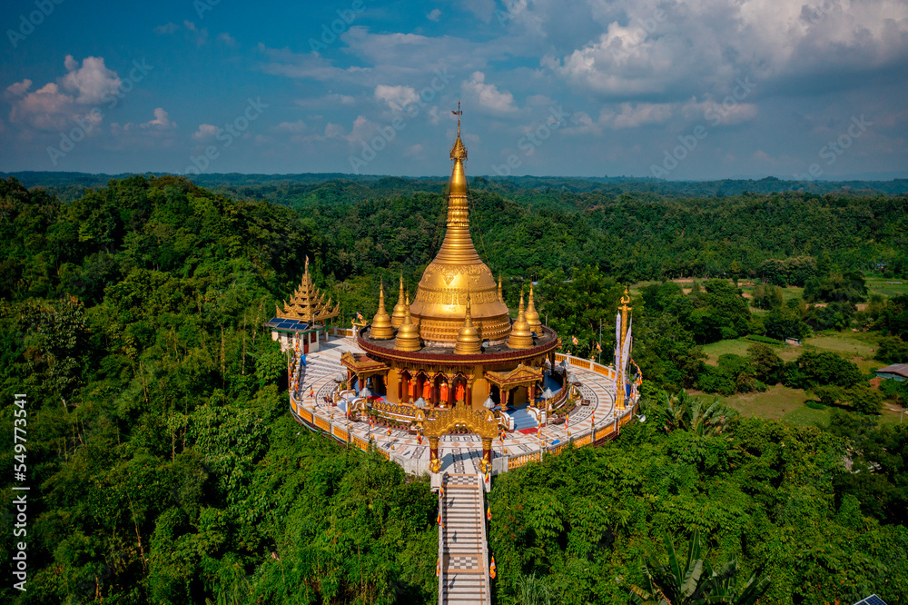 Aerial view of Bandarban temple with golden dome and big statue ...