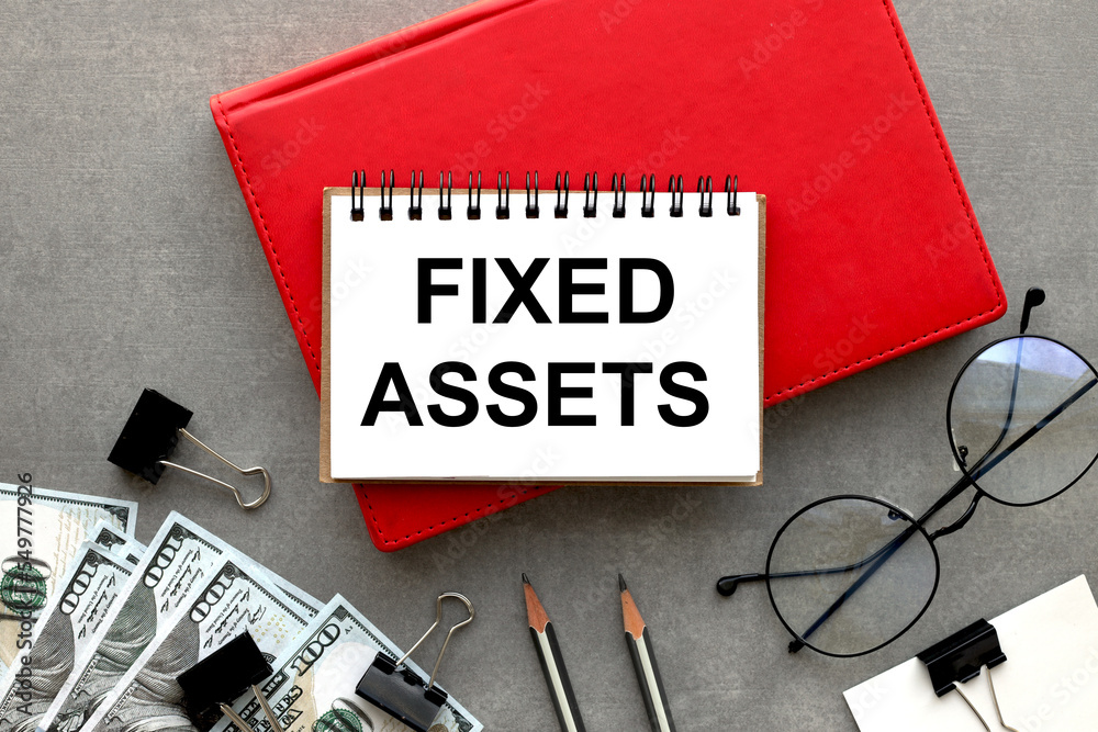 fixed assets. gray background red diary. text on notepad Stock Photo ...