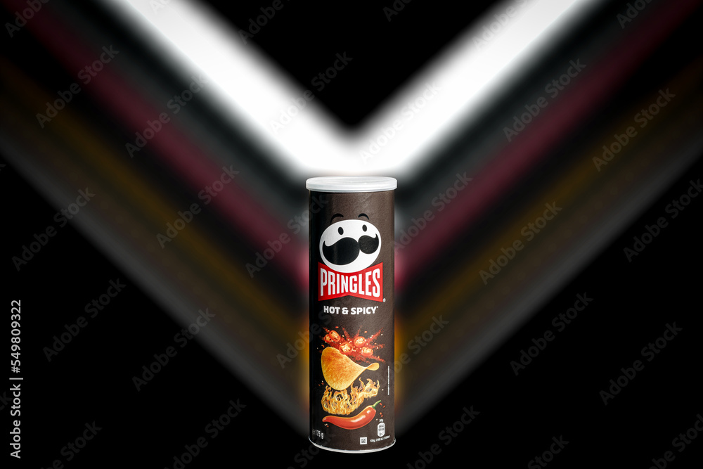 hot and spicy pringles crisps with effect on black background ...