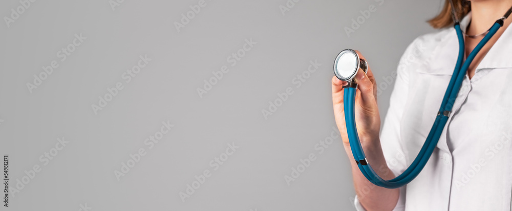 Doctor hand listening with stethoscope on ad background, banner ...