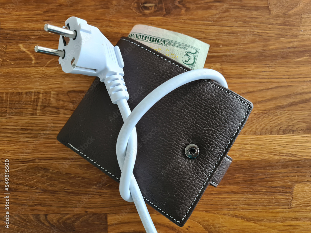 5 five dollar bill and electric plug in leather wallet Stock Photo ...