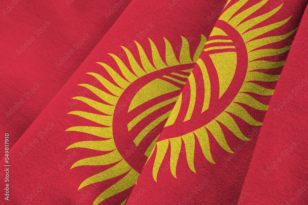 Kyrgyzstan flag with big folds waving close up under the studio light ...