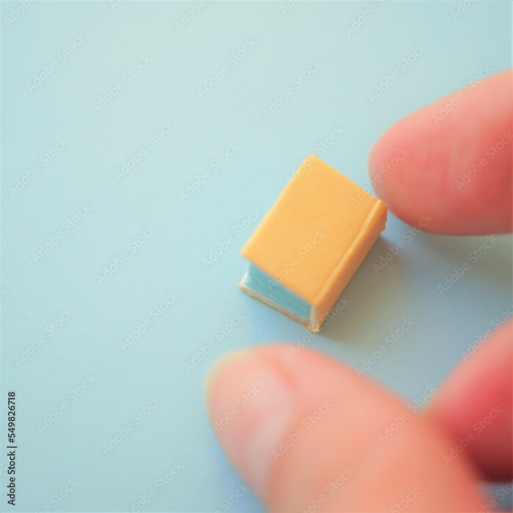 Miniature book touch female fingers, mini book notepad craft on the ...