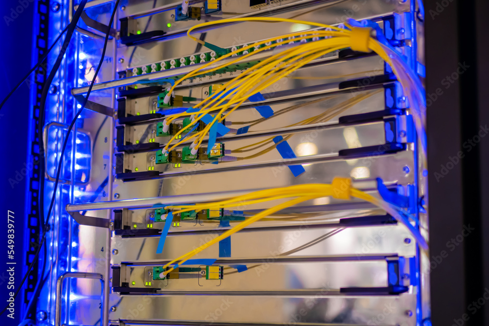 Telecommunication technology equipment - fiber optic cables and switch at server room, data ...