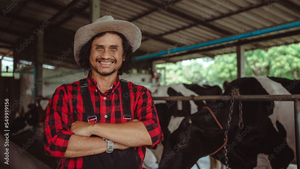 smiling and happy farmers at the dairy farm. Agriculture industry ...