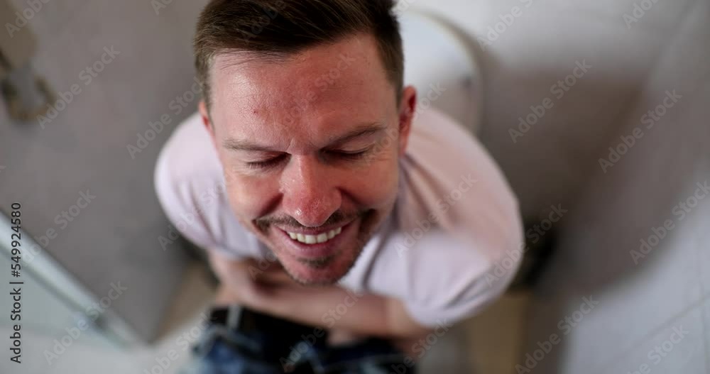 Man stomach ache constipation hemorrhoids sitting on toilet in bathroom ...