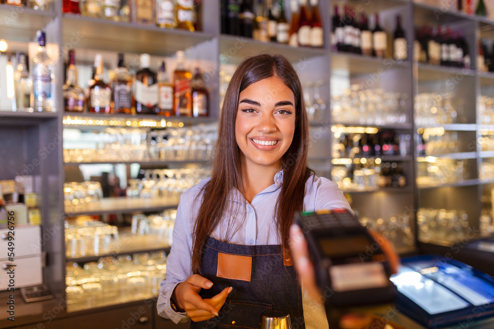 Contactless payment concept, female holding terminal nfc technology on ...