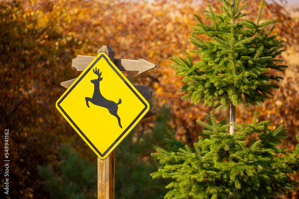 Deer crossing warning yellow sign, California, USA. Caution wild ...