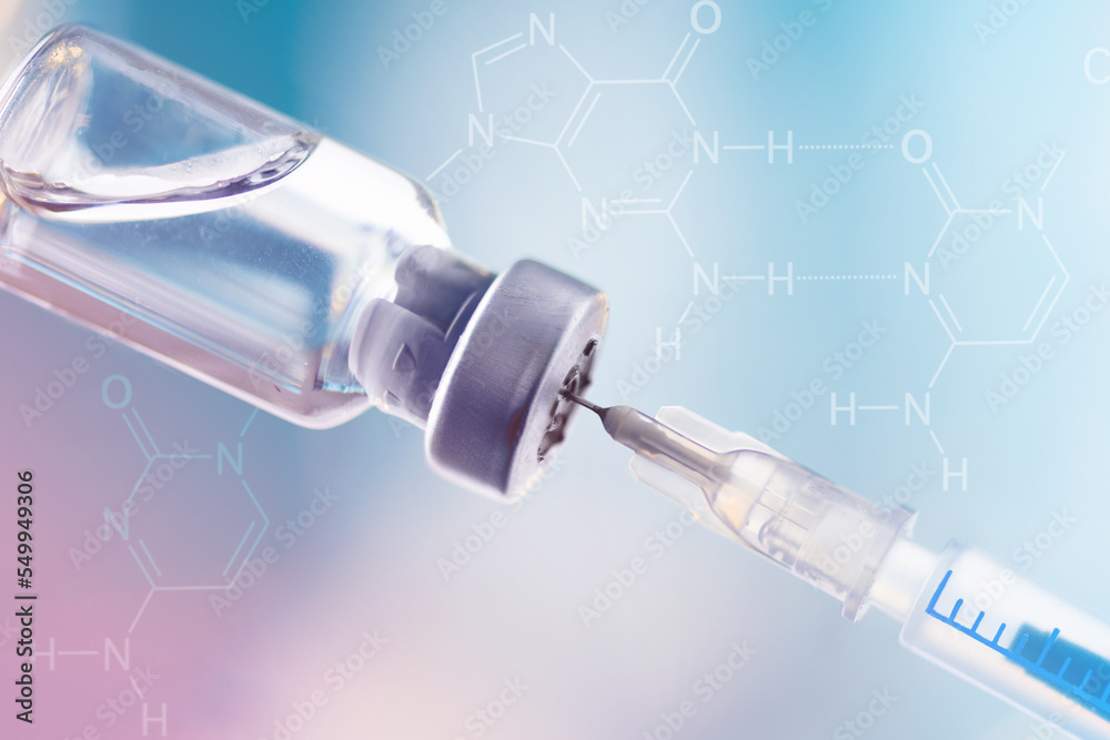 Glass vial and syringe with injection over blue background. Vaccination ...