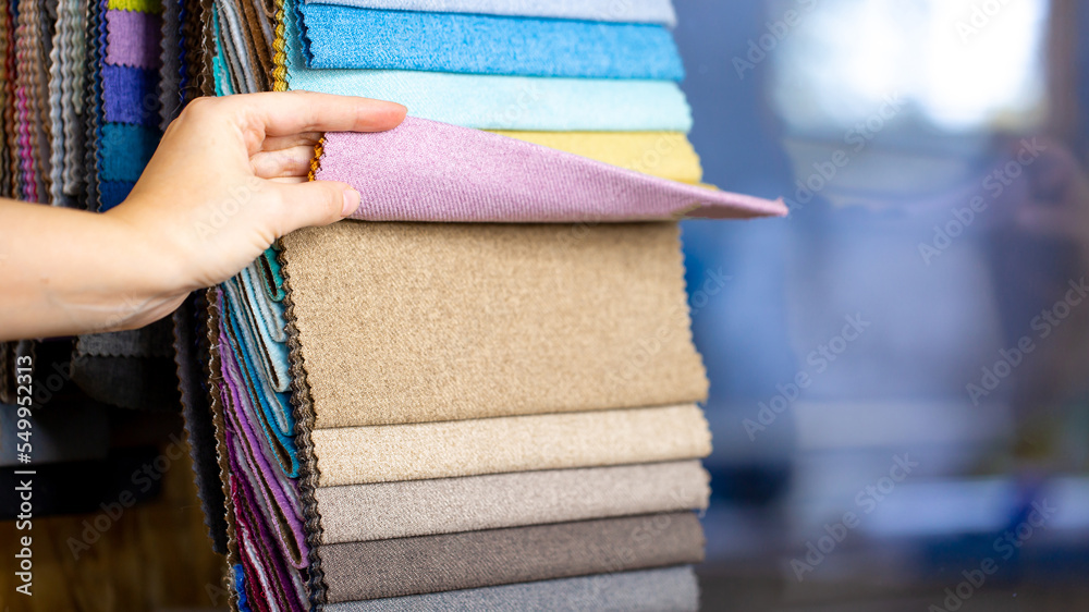 Fabric swatches in different colors are stacked for selection. The ...