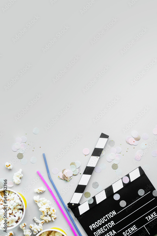 clapperboard, film strip and confetti for movie party. stylish layout ...