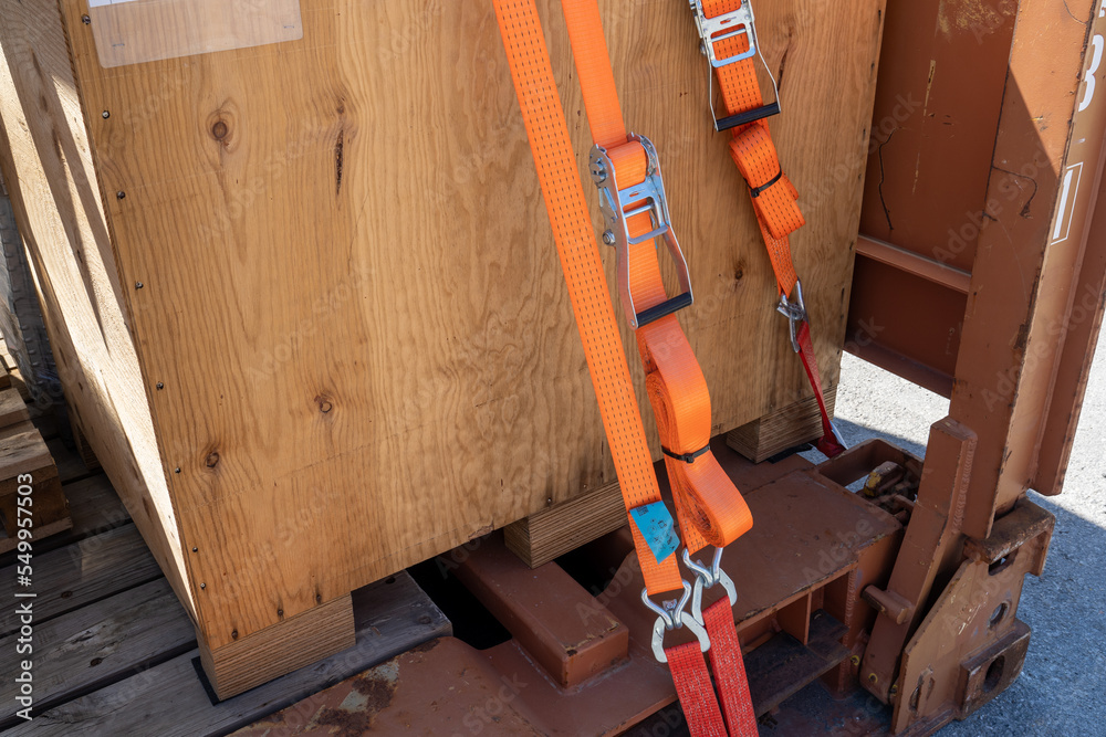 Tension safety belts with mechanical locks. On a pallet or in a ...