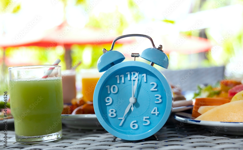 Blue alarm clock Intermittent fasting eight hour feeding window concept ...