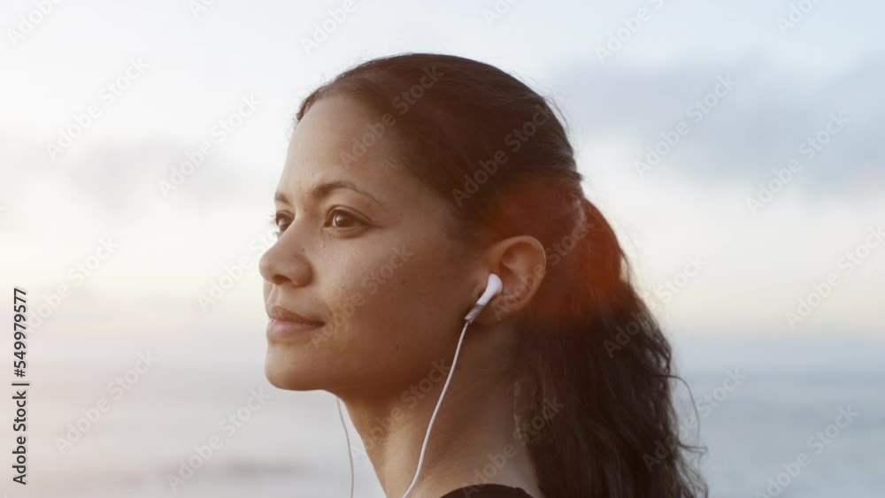 Happy woman, fitness and music motivation, sunset and ocean, exercise ...