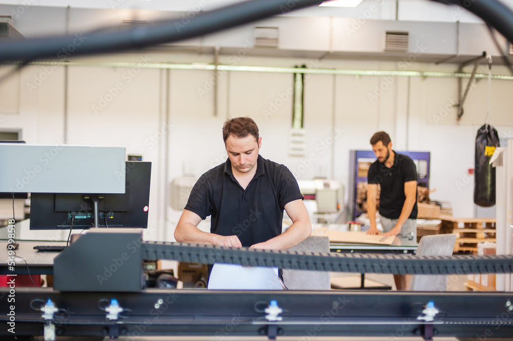 Professional workers graphic technicians operators work in a printing ...