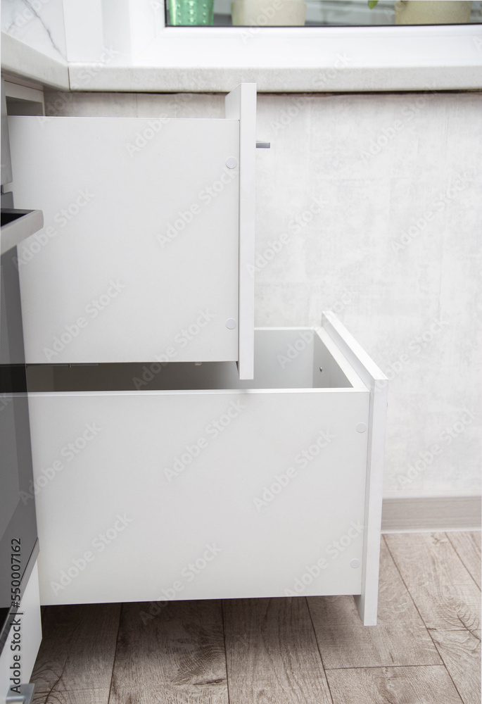 Modern sliding drawer system in the kitchen. Production of kitchen ...