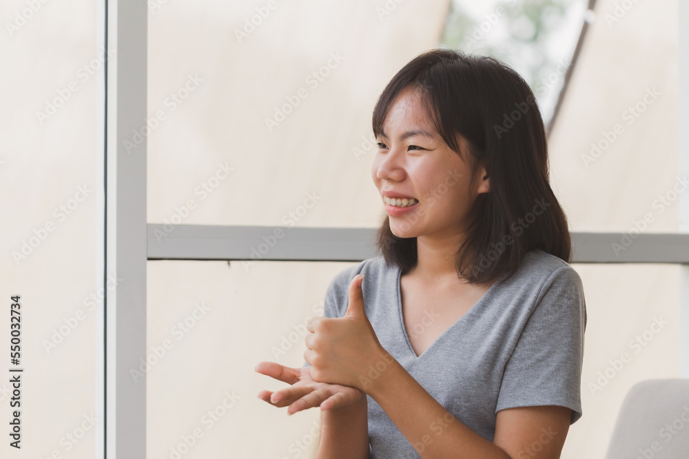 Young attractive Asian women using sign hand finger language ...