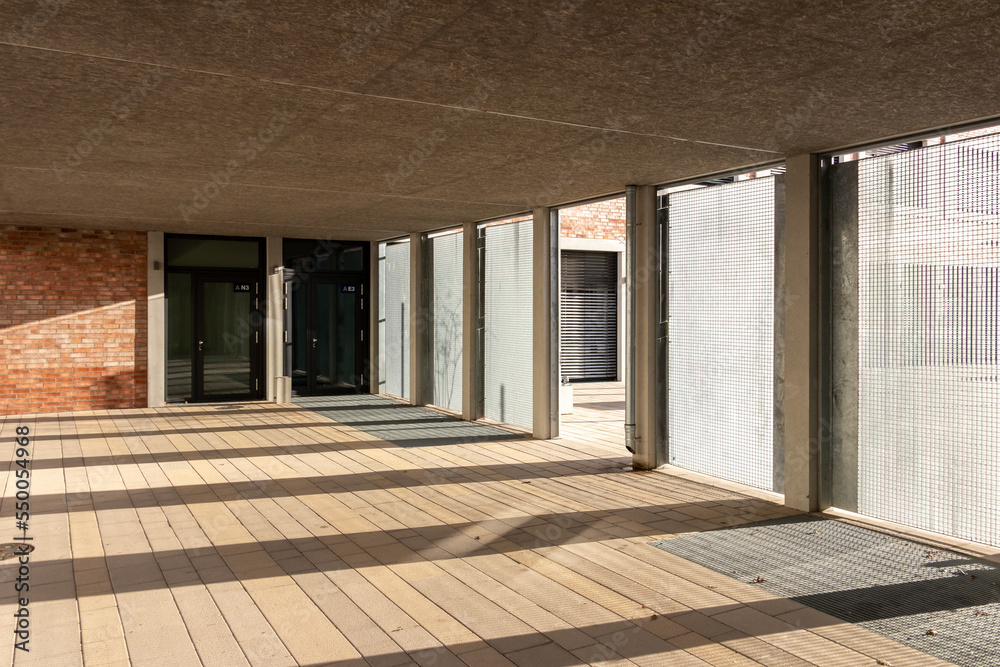 Inside view of an empty room of a residential building illuminated with ...