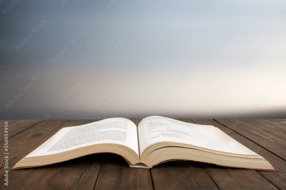 Big open book on a desk for reading concept Stock Photo | Adobe Stock